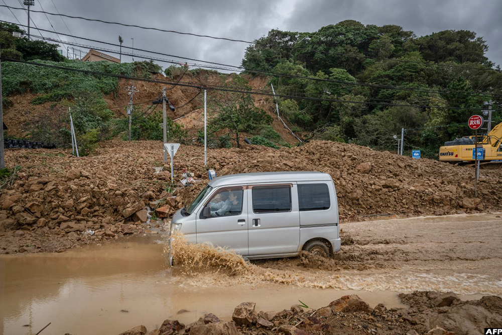 Floods, landslides hit central Japan months after major quak