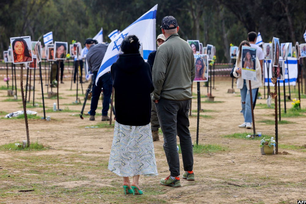 Israel hostage relatives relive trauma at site of rave attack - New ...